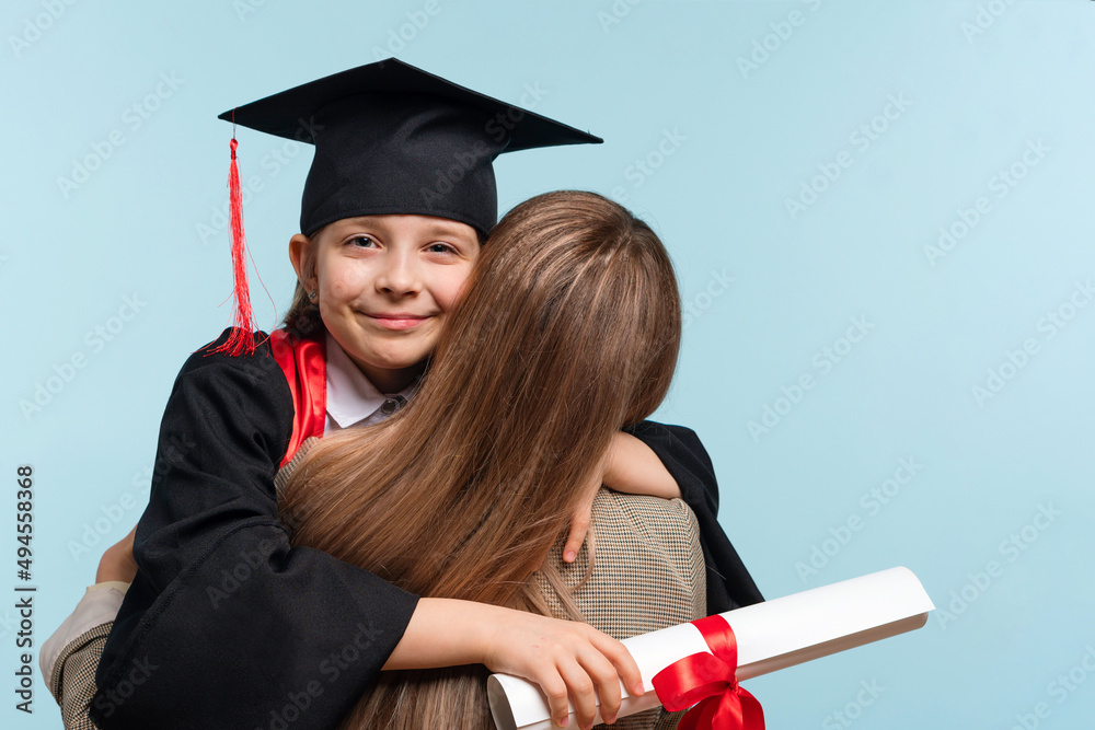 Little girl graduate celebrating graduation. Child wearing graduation ...