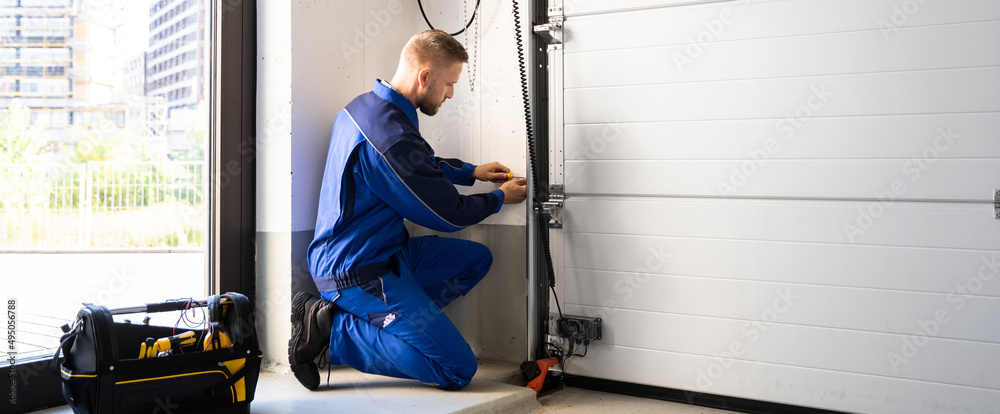 Garage Door Installation And Repair At Home. Contractor Man Stock Photo ...