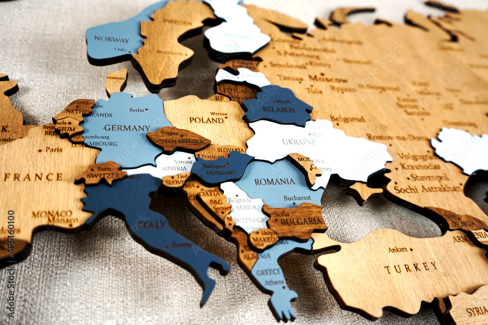 Europa on the political map. Wooden world map on the wall. Italy ...