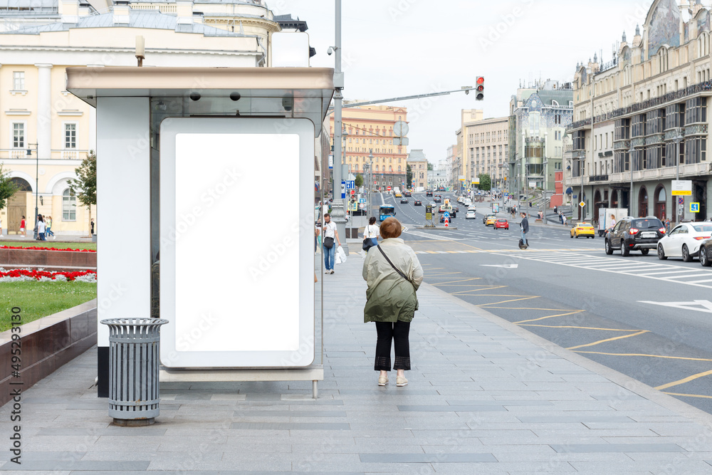 Vertical billboard at a public transport stop. Central street, the ...