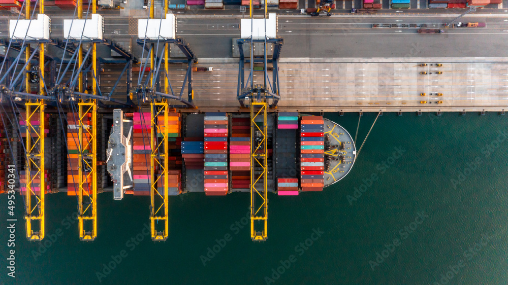 Container ship loading and unloading at deep sea port, Aerial view ...