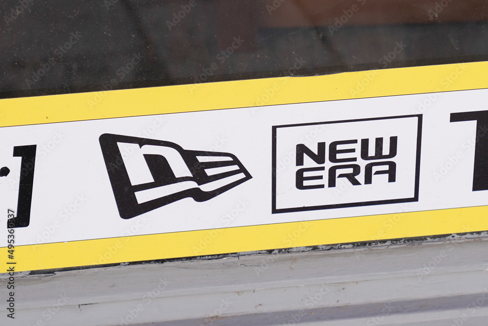 New Era brand logo and text sign on windows shop front of retailer for ...