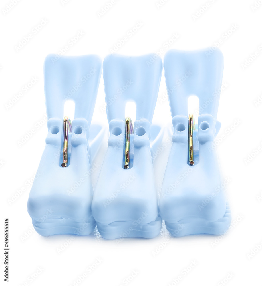 Plastic clothes pins on white background Stock Photo | Adobe Stock
