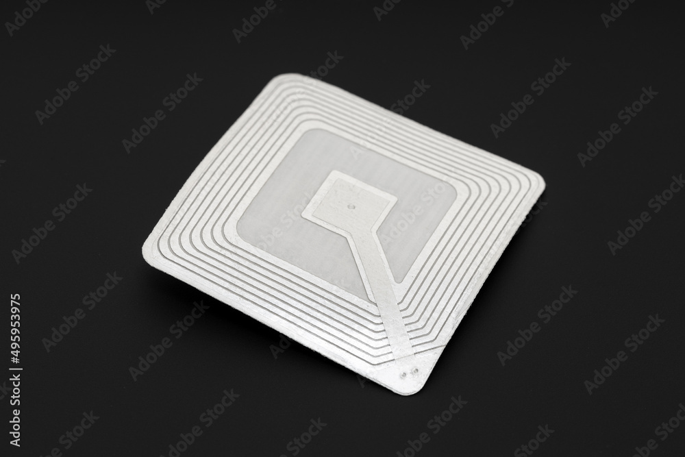 RFID tag isolated on black background. Radio frequency identification ...