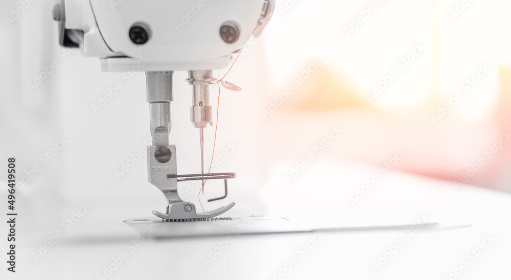 Closeup sewing machine for pocket, background white color sunlight ...