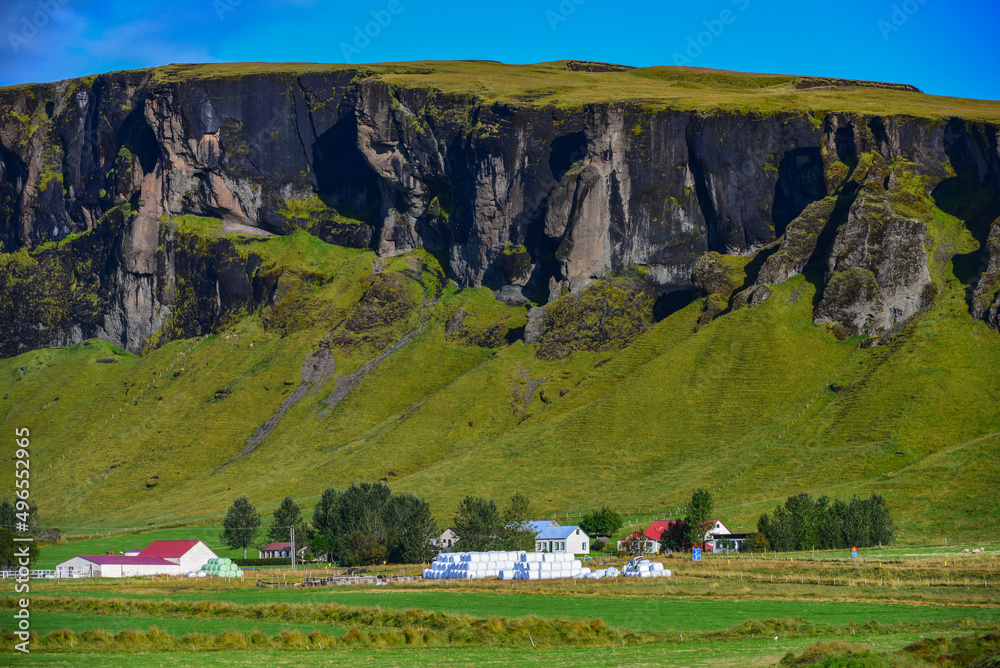 Farms below volcanic cliffs as seen from the Ring Road (Route One ...