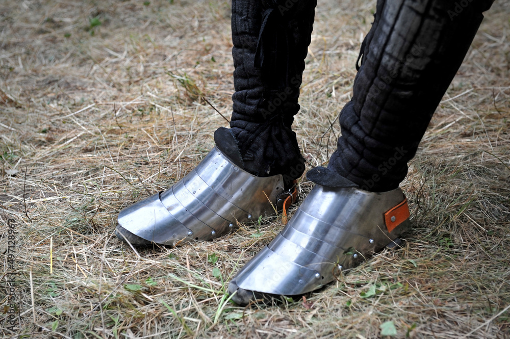 Metallic protection of the feet of the medieval knight. Armor shoes ...