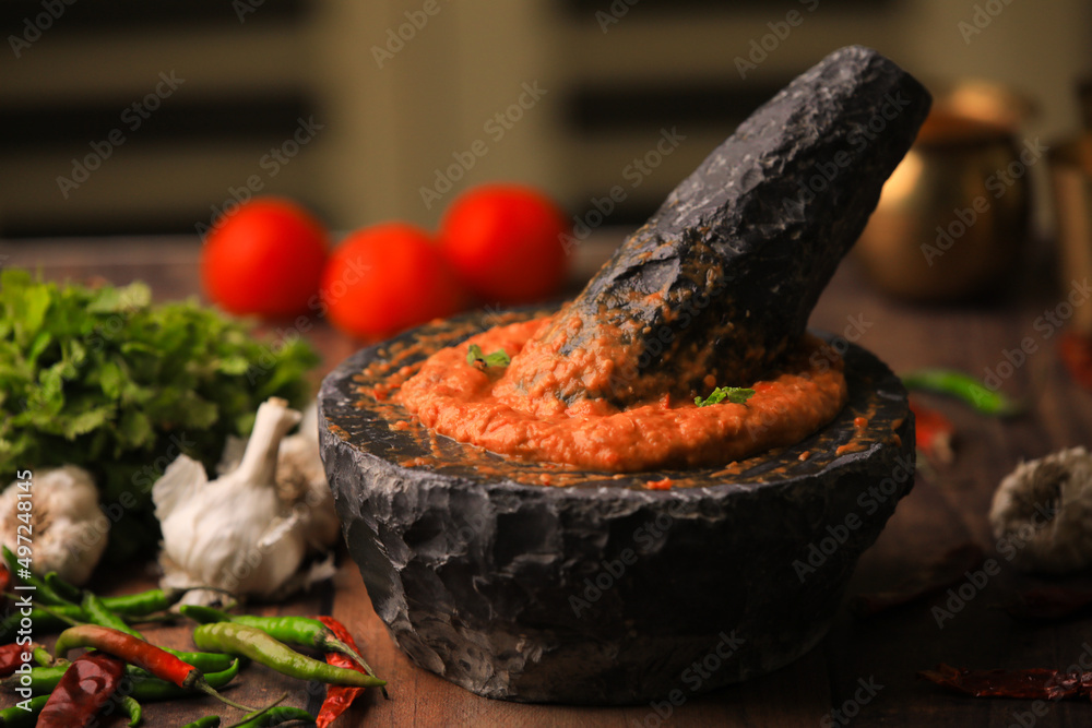 chutney grinding in mortar and pestle,south indian food Stock Photo ...