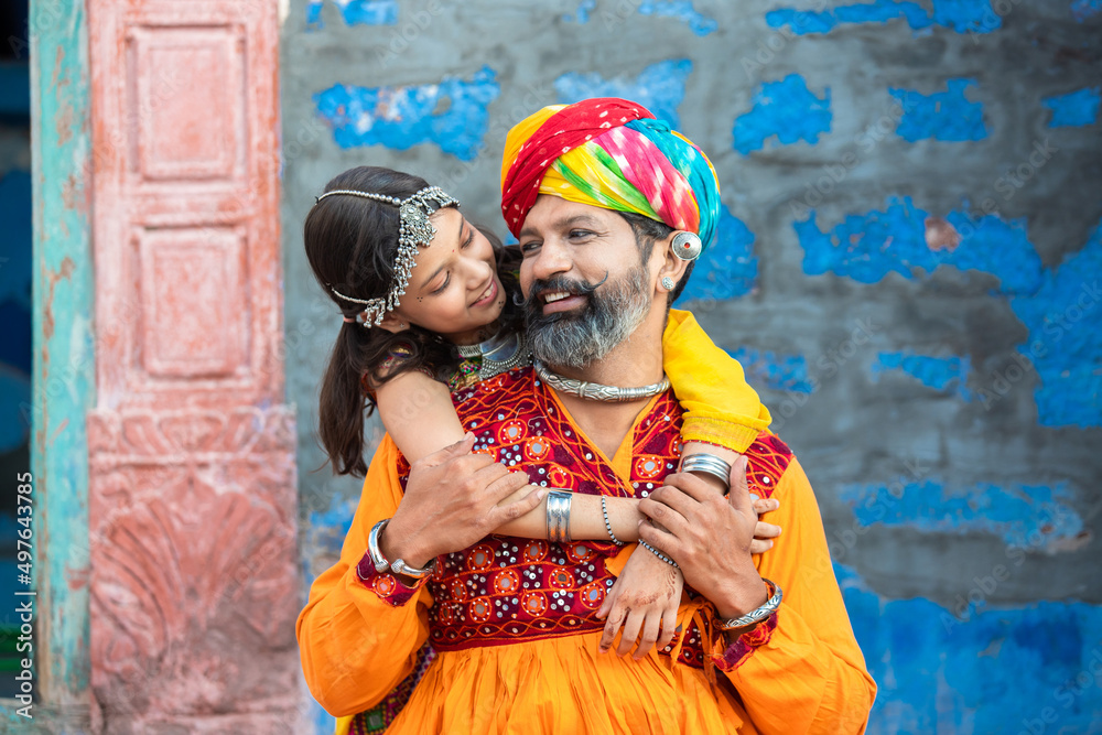Portrait of happy indian father daughter hugging wearing traditional ...