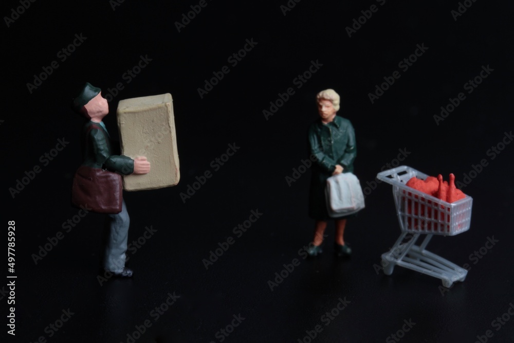 miniature figurines of a postman delivering a parcel to an old woman ...