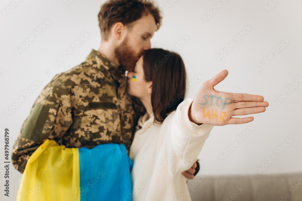 Ukrainian soldier in military uniform with his girlfriend showing a ...