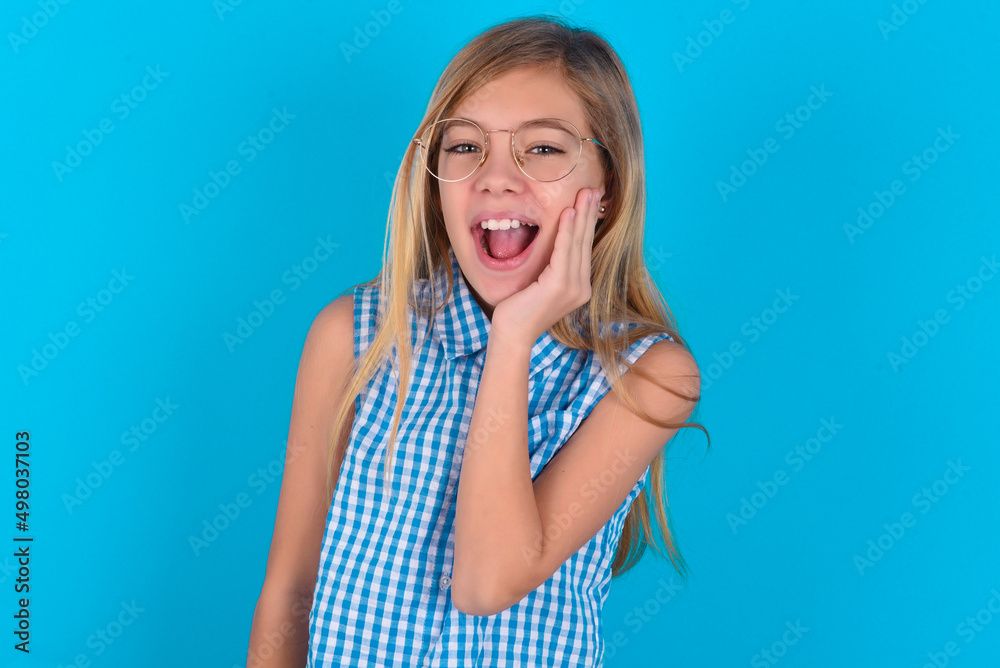 Shocked, astonished little kid girl with glasses wearing plaid shirt ...