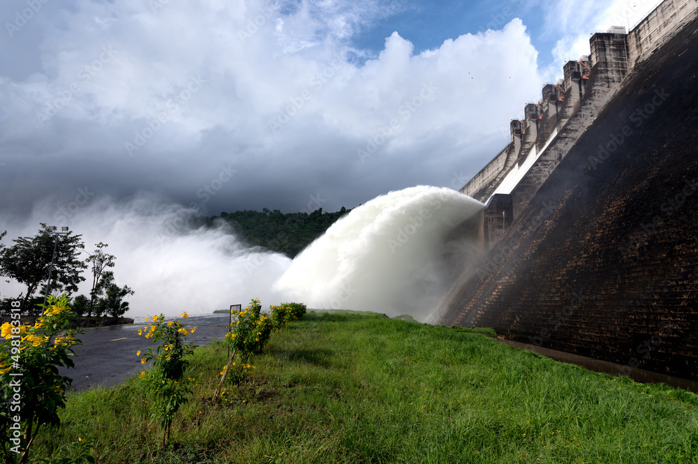 Overview of open the drainage through the dam spillway after full water ...