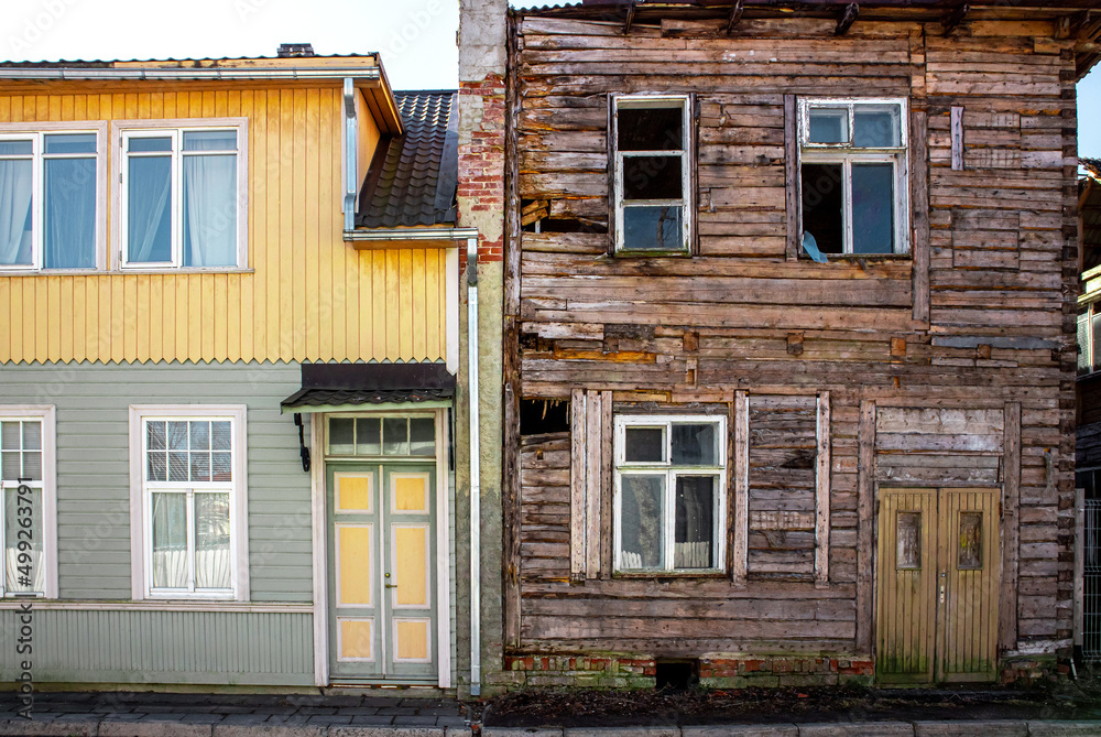 Old wooden two story apartment building around 1940-1950, one side is ...