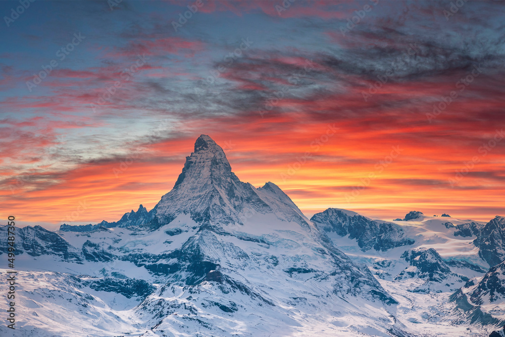 Idyllic Matterhorn mountain in alps against cloudy sky during sunset ...