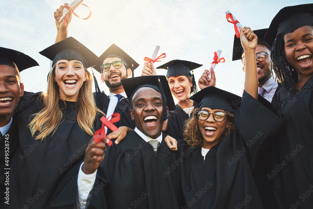 We worked hard to get here. Shot of a group of cheerful university ...