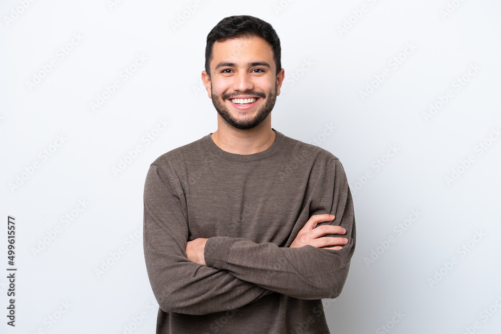 Young Brazilian man isolated on white background keeping the arms ...