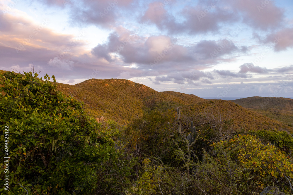 Sunrise over Christoffel National Park during the hike up to the top of ...
