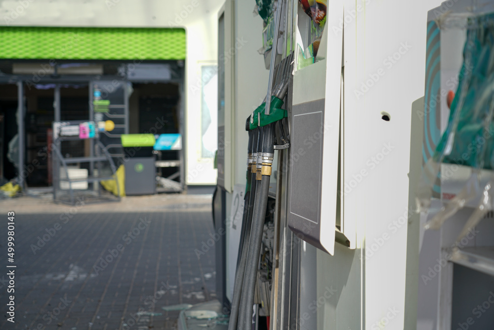 Gas station with a broken station from a shell explosion. Exploded gas ...