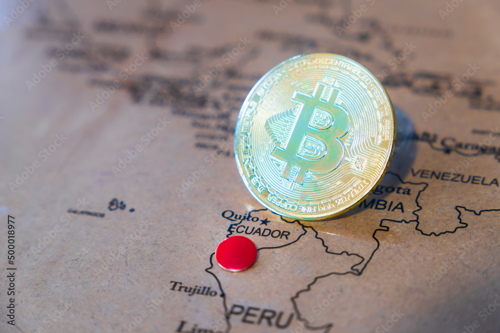 Bitcoin symbol standing on the world map, Ecuador is pinned on the map ...