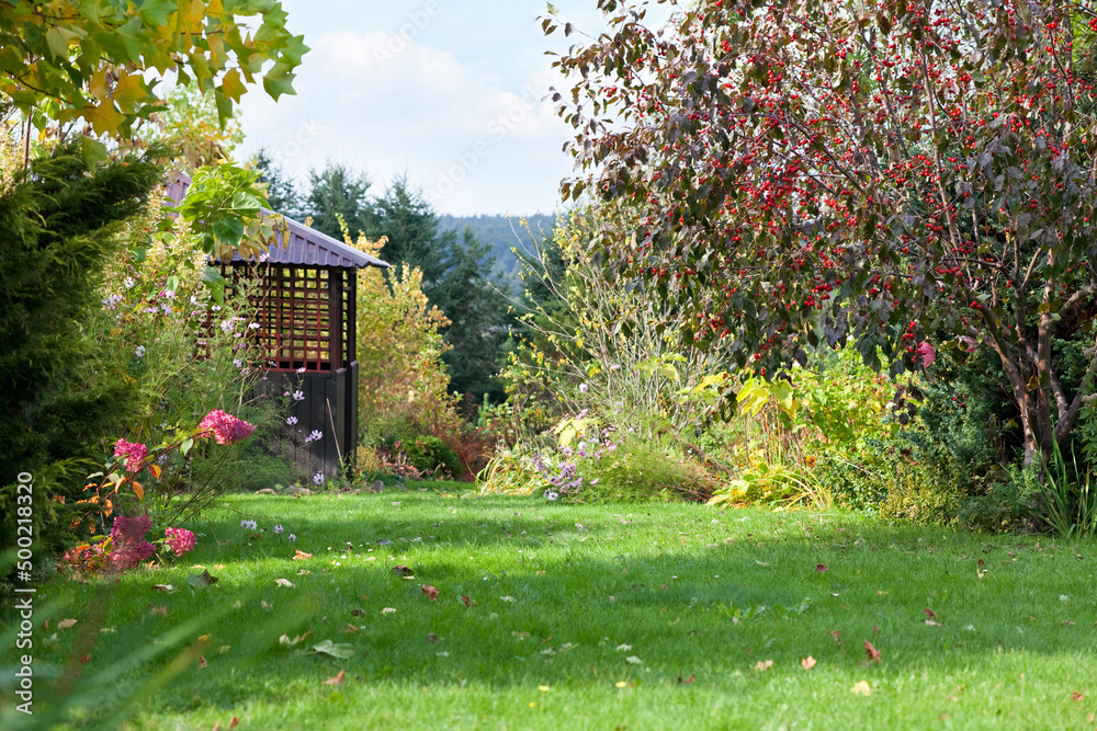 Summer house in the beautiful backyard green garden landscape and fresh ...