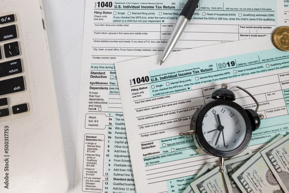 Blank forms 1040. US personal income tax return with accessories. Tax ...