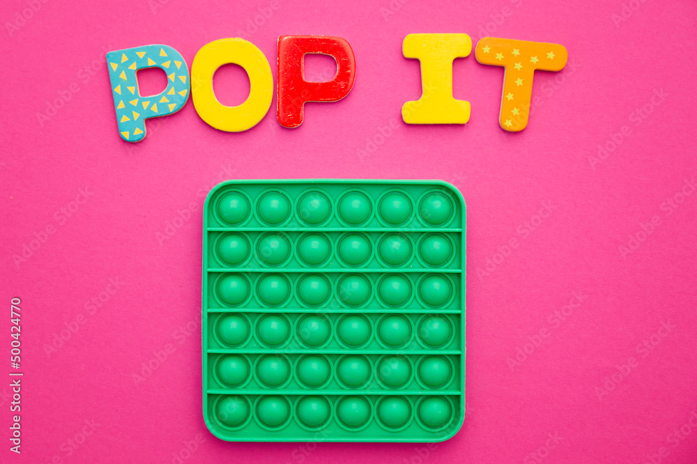 Foto Sensory fidget toy "Pop-it". Instrument for fine motoric skils ...