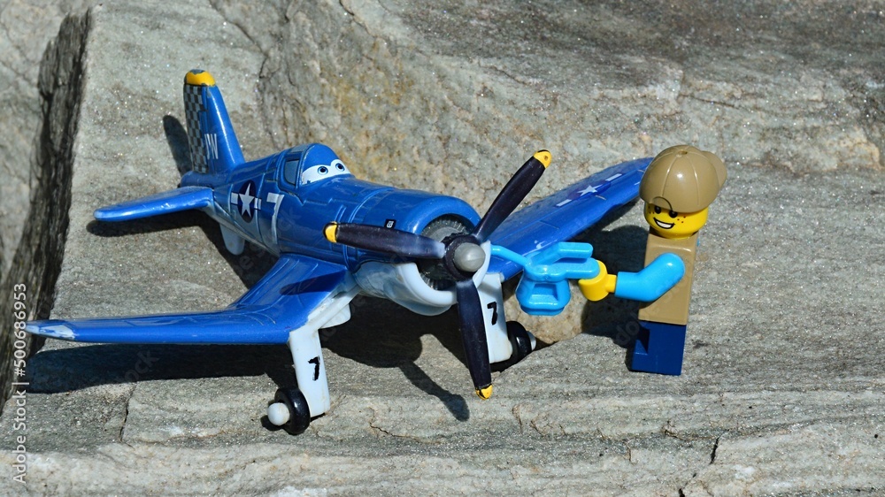 LEGO City boy figure adding oil to the propeller of Skipper plane model ...