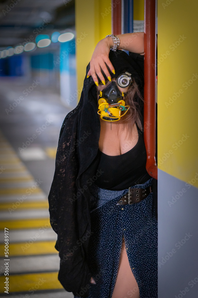 Sexy cyborg witch in cyberpunk goggles and a custom respirator, hooded ...