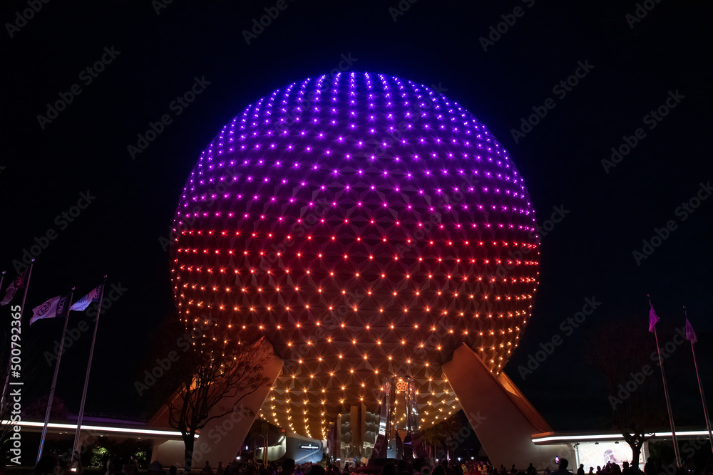 Nighttime view of the geodesic sphere at the entrance of Walt Disney ...