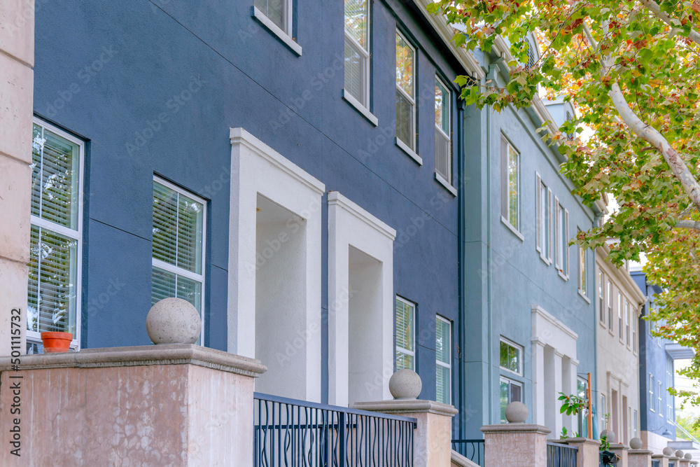Townhouses side view with white trims and blue color palette at Silicon ...