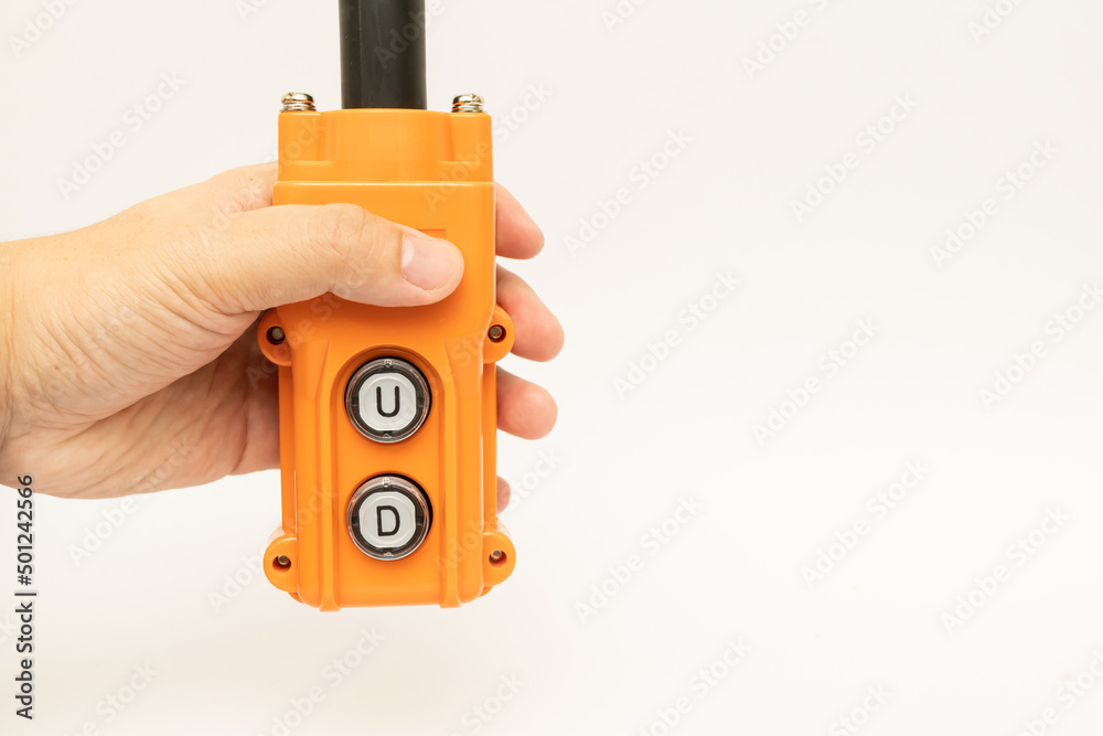 Foto de Stock Hoist push button switch in isolated. hand holding ...