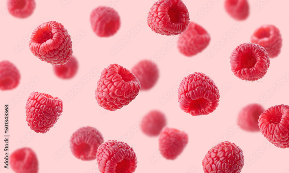 Various falling fresh ripe raspberries on light pink background Stock ...
