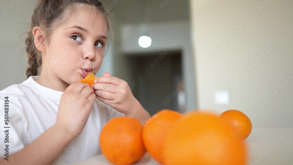 girl child eating oranges indoors. dream happy family fruit healthy ...