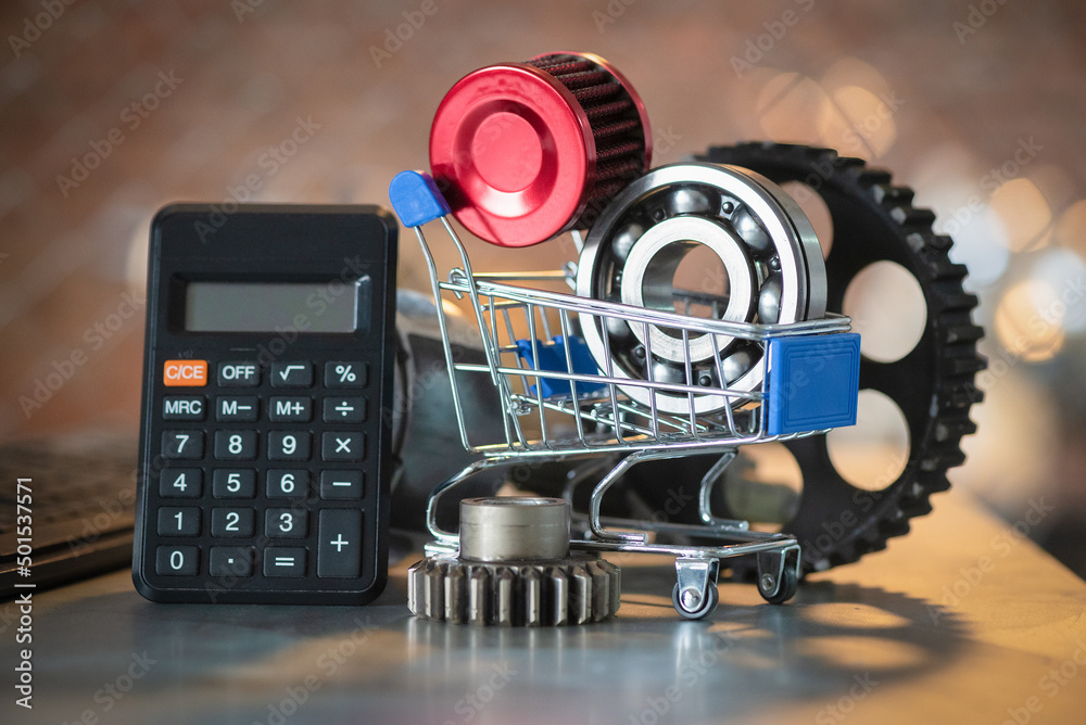 Car repair costs concept. Automobile spare parts cost estimate. Calculator, engine piston and ...