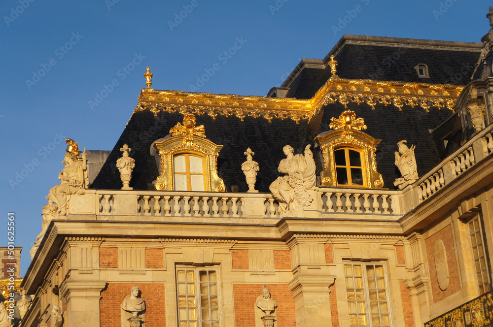 Golden window on a black roof, of the famous Palace of Versailles. The ...