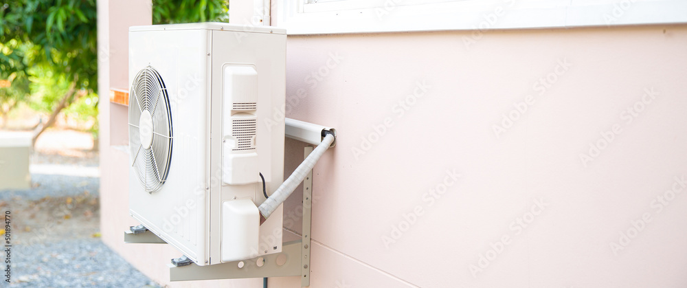 Air compressor, Close-up external split wall type of outdoor home air ...