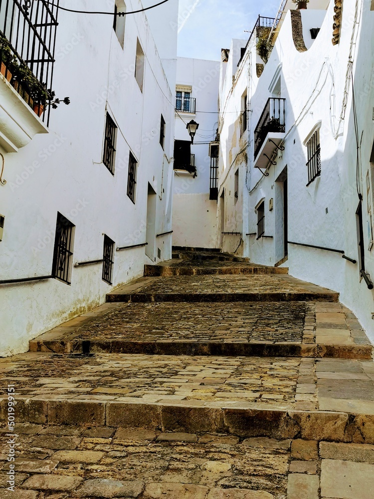 Typical Andalusian village street with its balconies, windows and ...