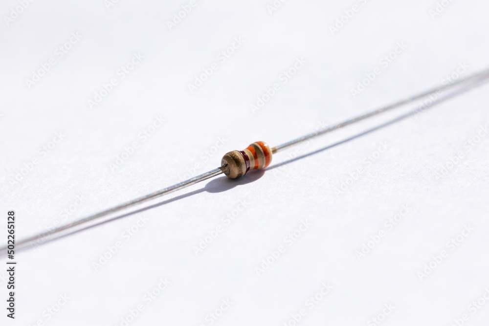 A close up portrait of a 330 ohm resistor with a 5% tolerance. The ...