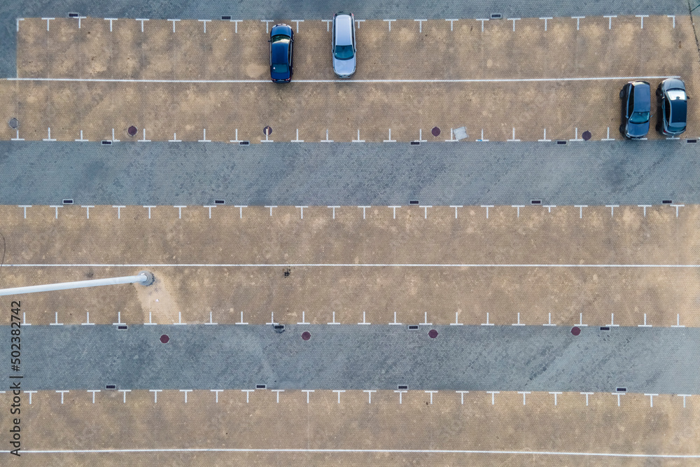 Aerial view of a few cars parked in an empty Parking lot in Cacilhas ...
