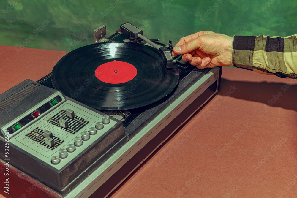 Image of old-fashioned vintage vinyl record player isolated over dark ...