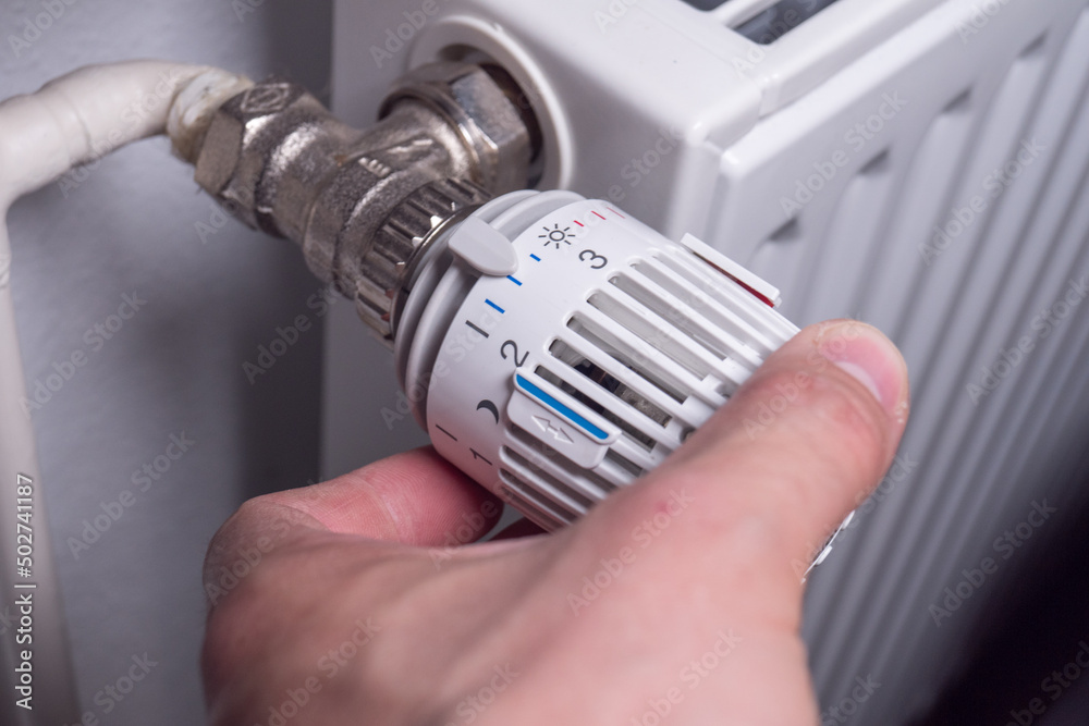 reduce the temperature on thermostat to save energy heating costs Stock ...
