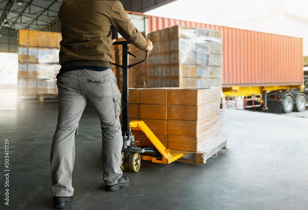 Workers Unloading Packaging Boxes on Pallets to The Cargo Container ...