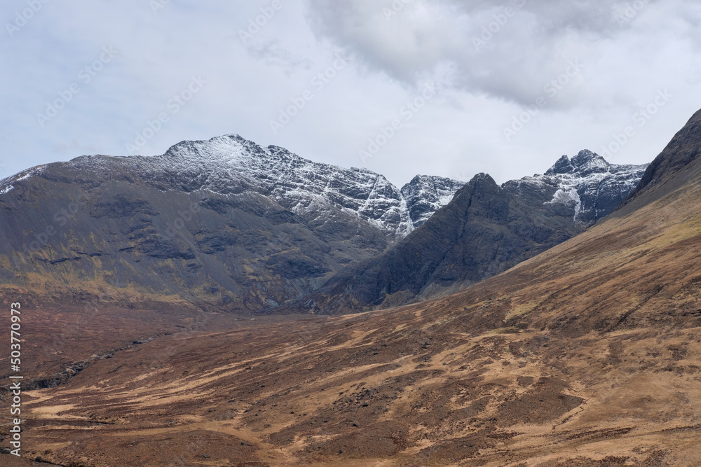 Frozen landscape surrounding Black Cuillin mountains, cold alien-like ...