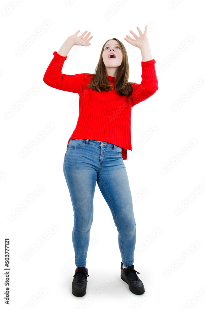 Shocked teenage girl looking up with his hands in the air. Adorable ...