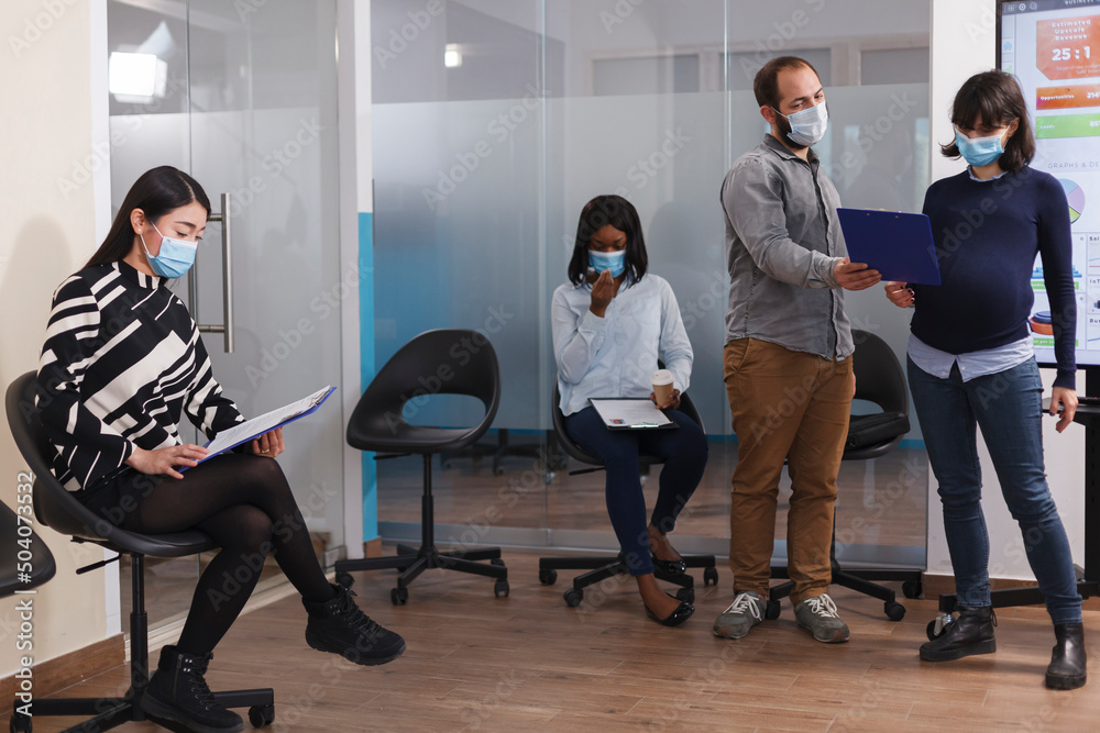 HR department pregnant manager wearing protective mask talking with man ...