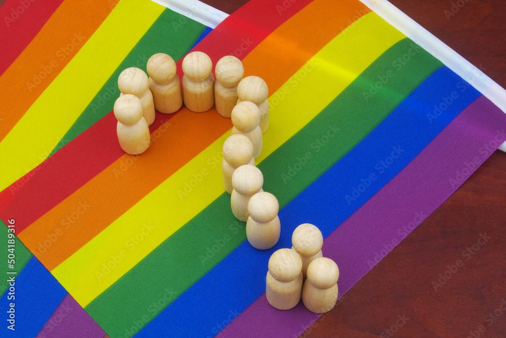 Questions about LGBT community concept. Female and male wooden people ...