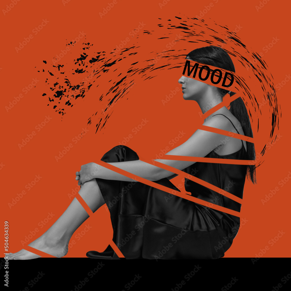 sad and unhappy woman sitting on orange background with a depressive ...