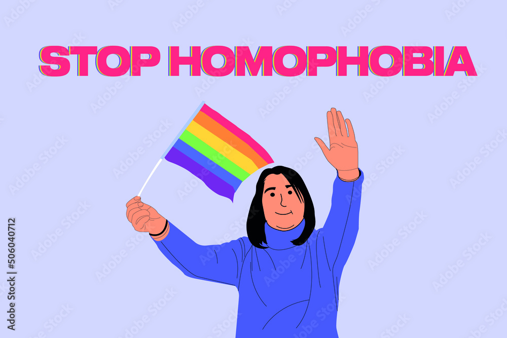 Young women holding lgbt flag and say stop homophobia at a gay pride ...