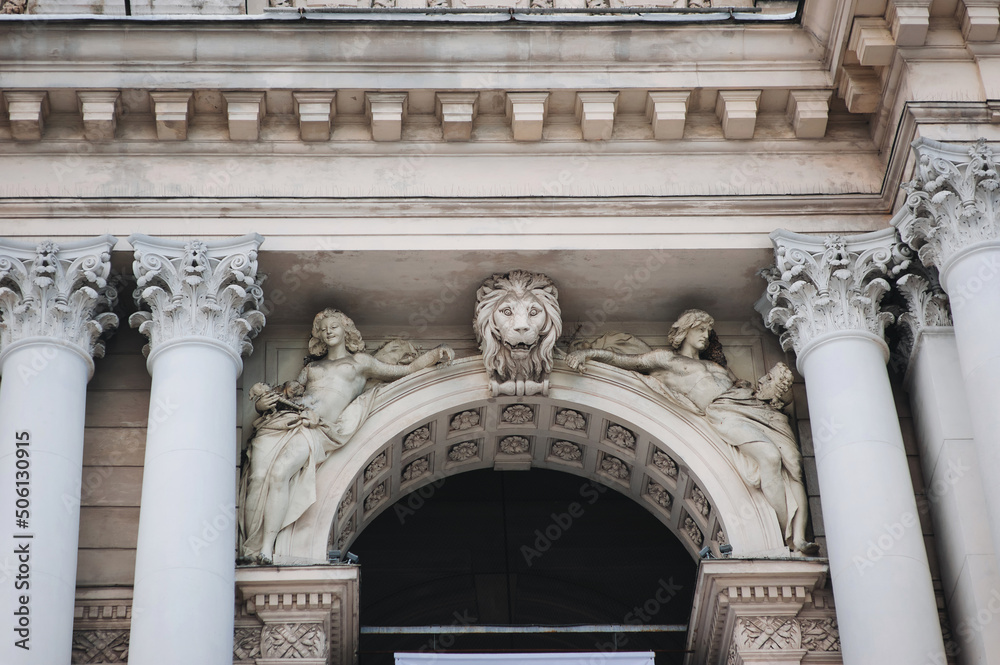 Two sculpture muse of allegory of arts and lion on the facade of the ...